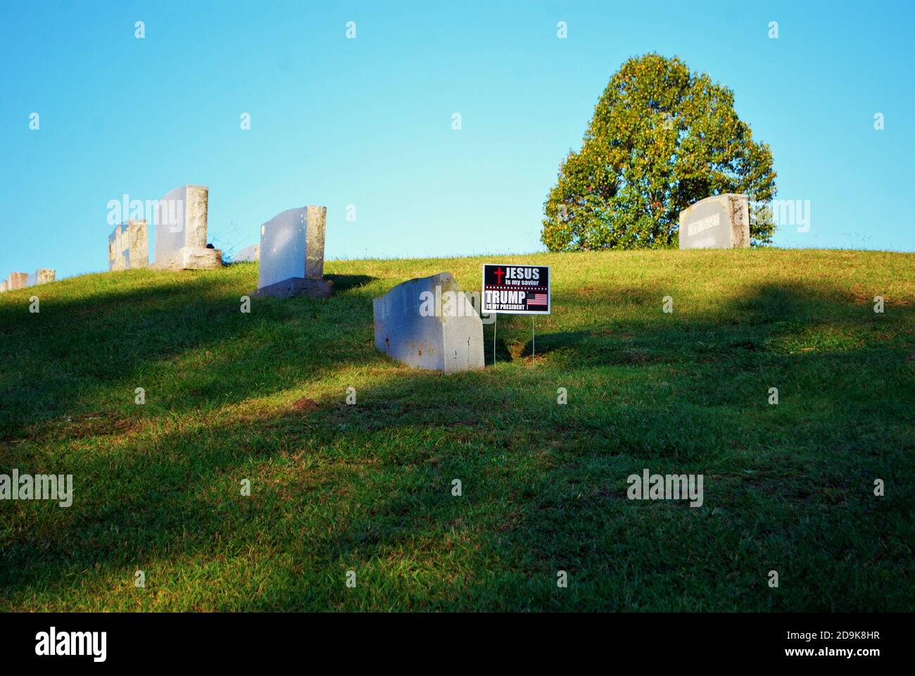 Trump yard sign next to a headstone in cemetery jesus is my savior ...