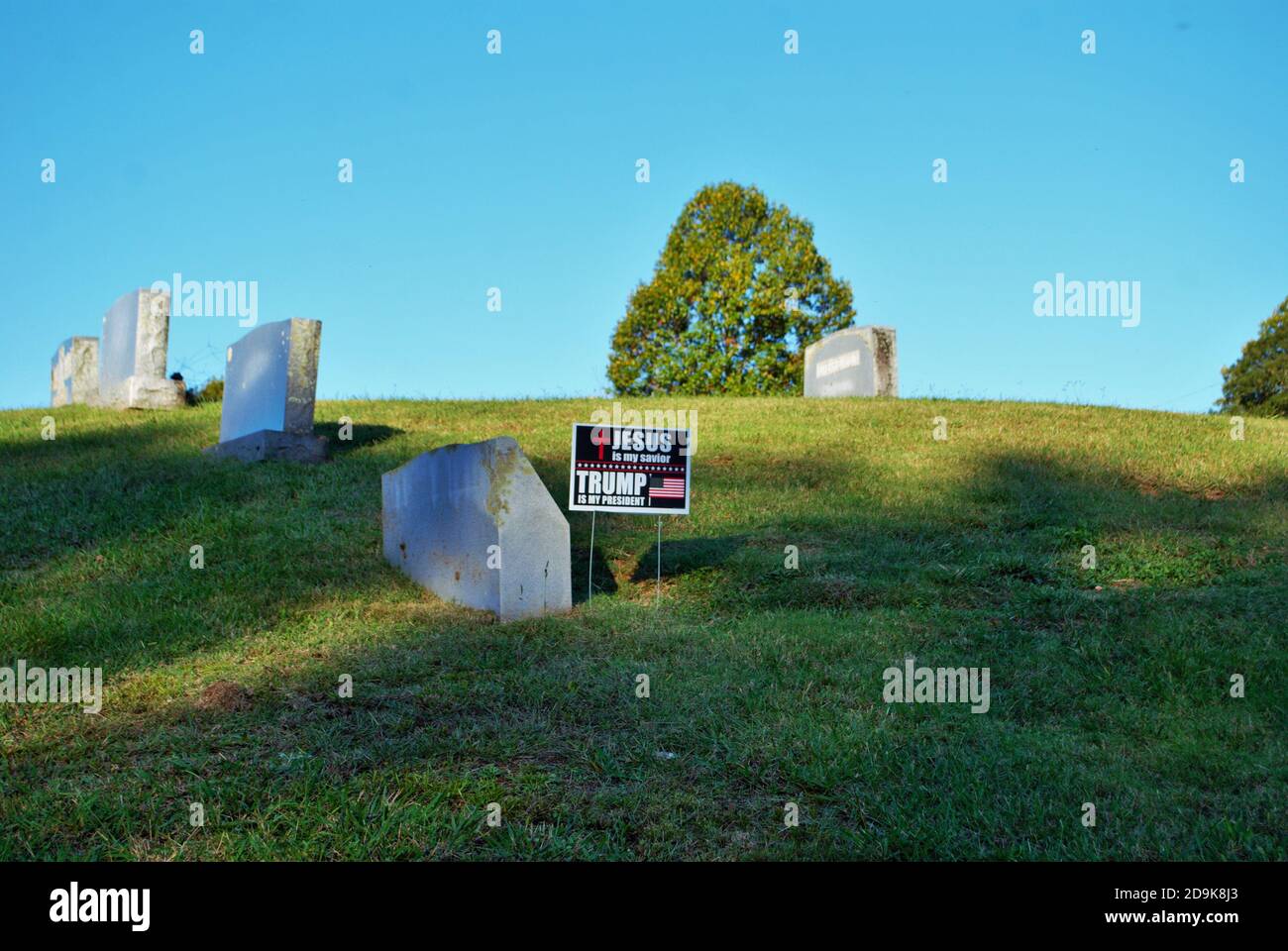Trump yard sign next to a headstone in cemetery jesus is my savior ...
