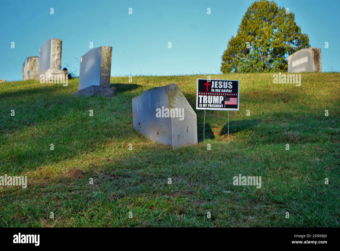 Trump yard sign next to a headstone in cemetery jesus is my savior ...