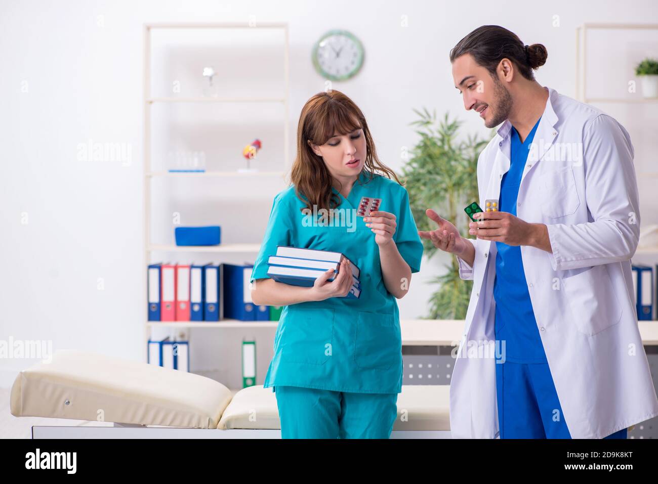 Two doctors colleagues working in hospital Stock Photo - Alamy