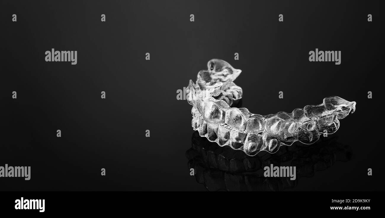 Invisible orthodontics cosmetic brackets on gradient background, tooth ...