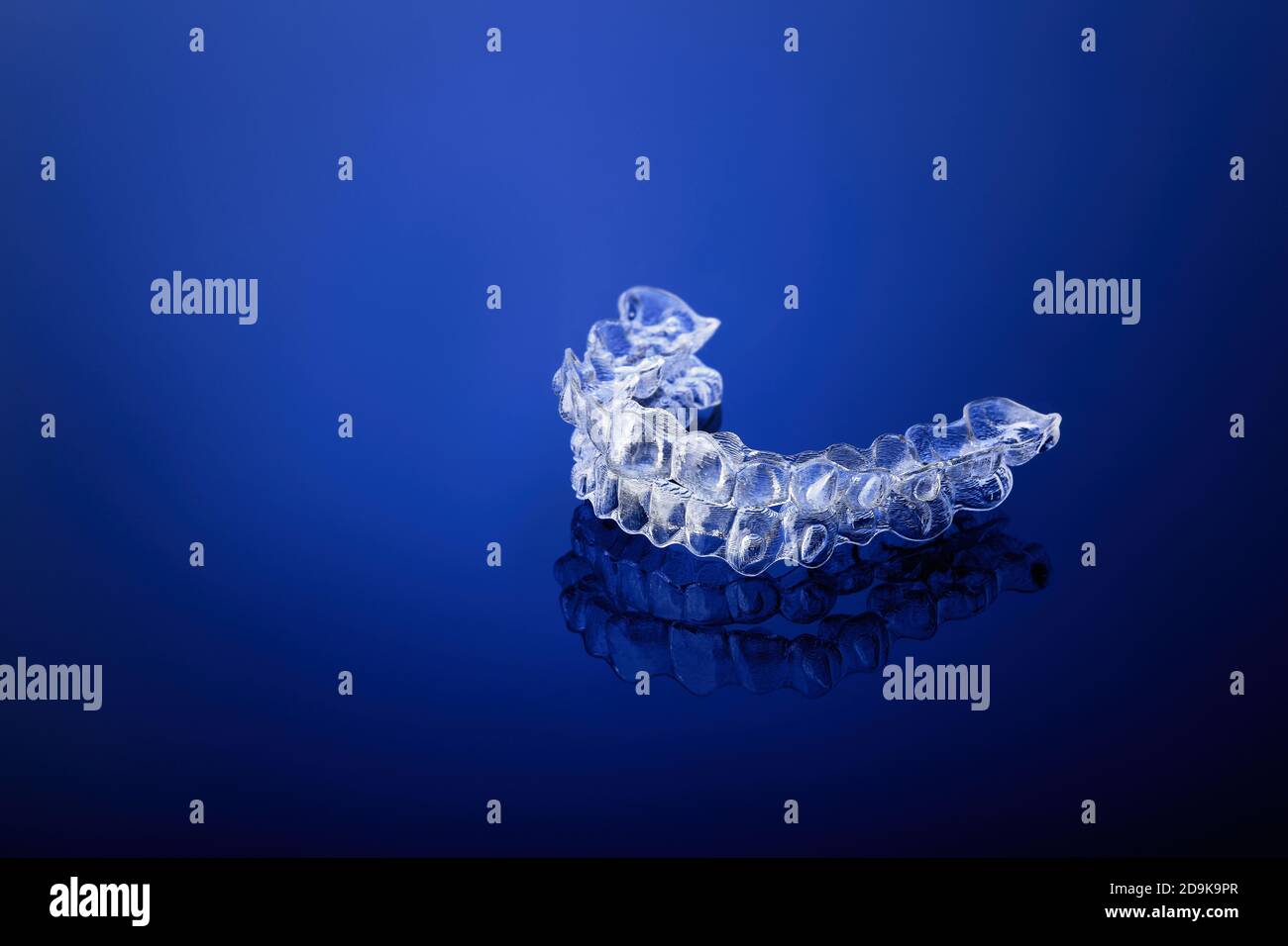 Invisible orthodontics cosmetic brackets on gradient background, tooth ...