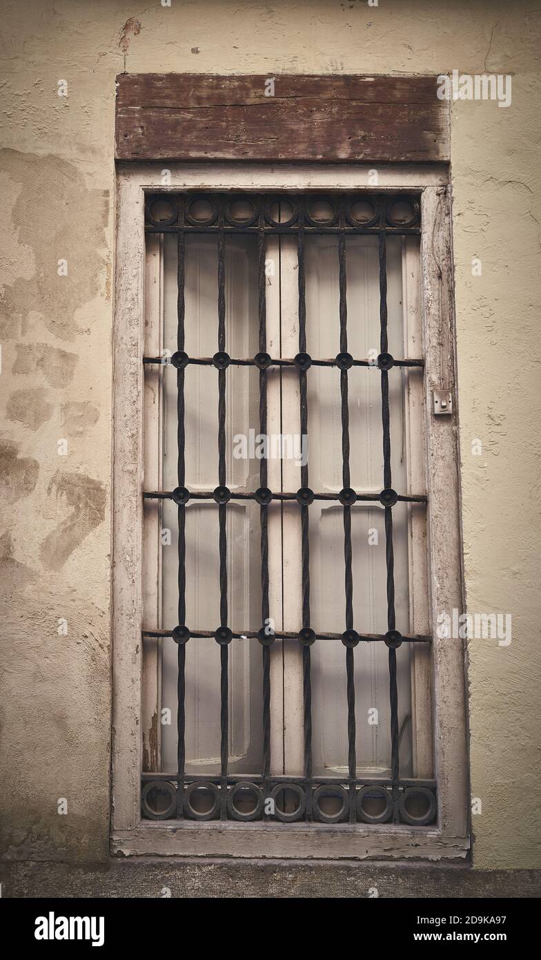 Vertical shot of a metal window on an od building Stock Photo - Alamy