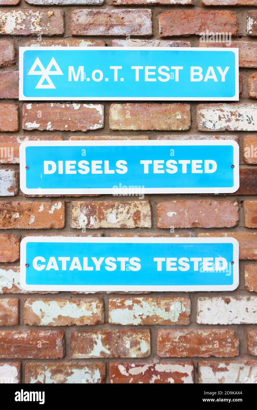 Signs outside a vehicle MOT test centre declaring diesels and catalysts ...