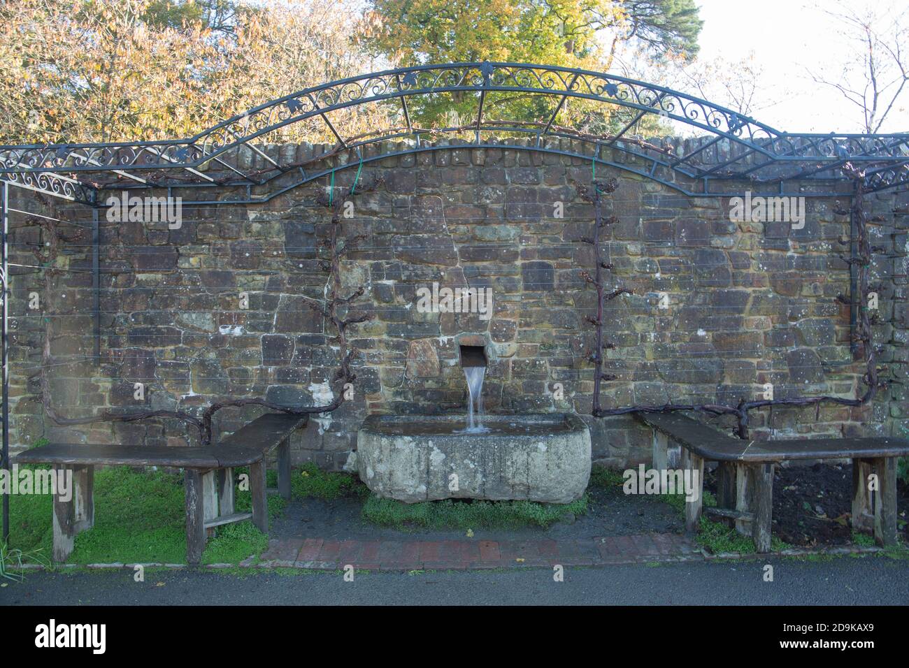 Waterfall trough by the seating area Stock Photo - Alamy