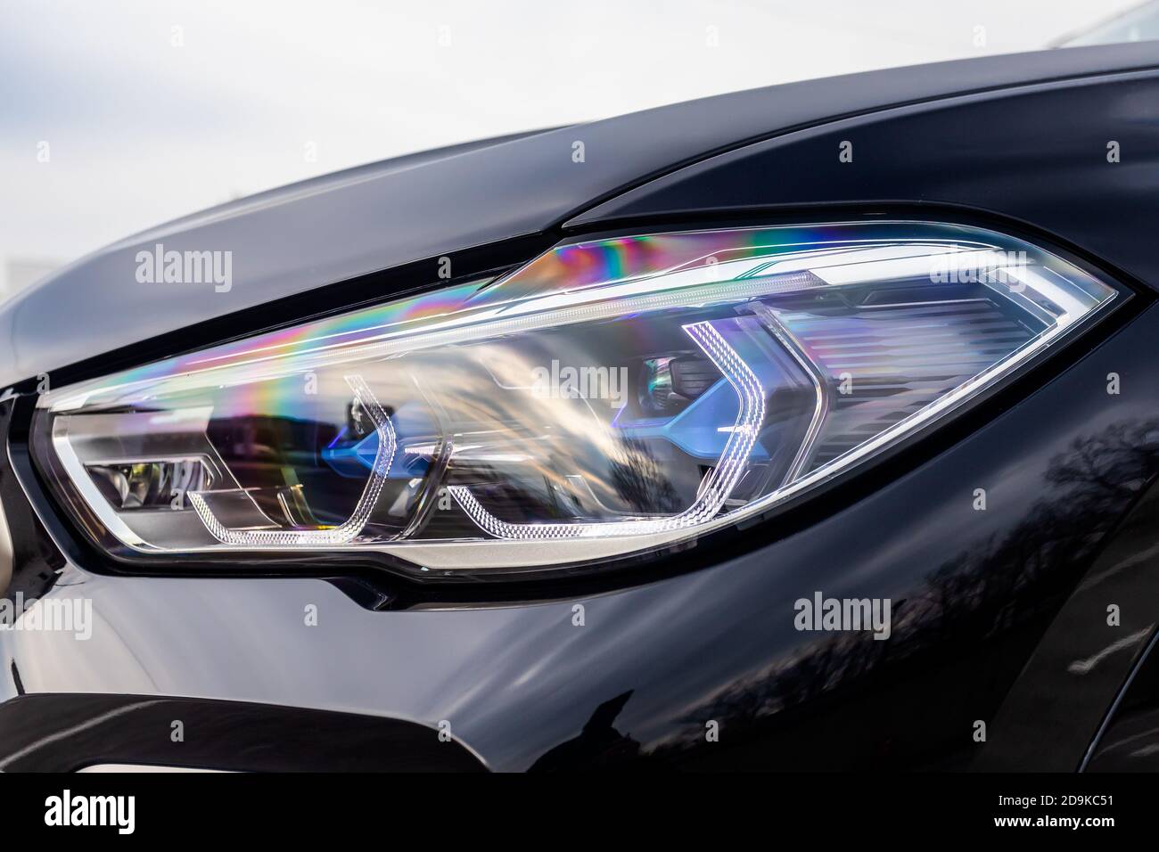 Glowing Headlight of a modern car close-up. Car xenon lamp headlight ...
