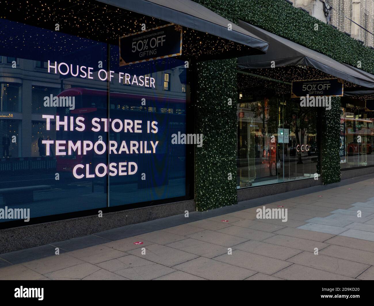 THIS STORE IS TEMPORARILY CLOSED: an electronic message in the window ...