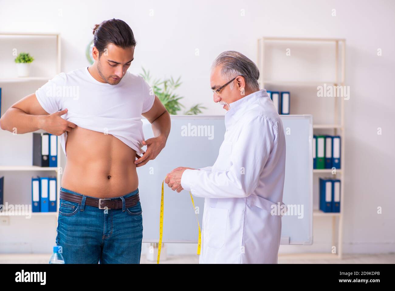 The doctor dietician giving advices to fat overweight patient Stock ...