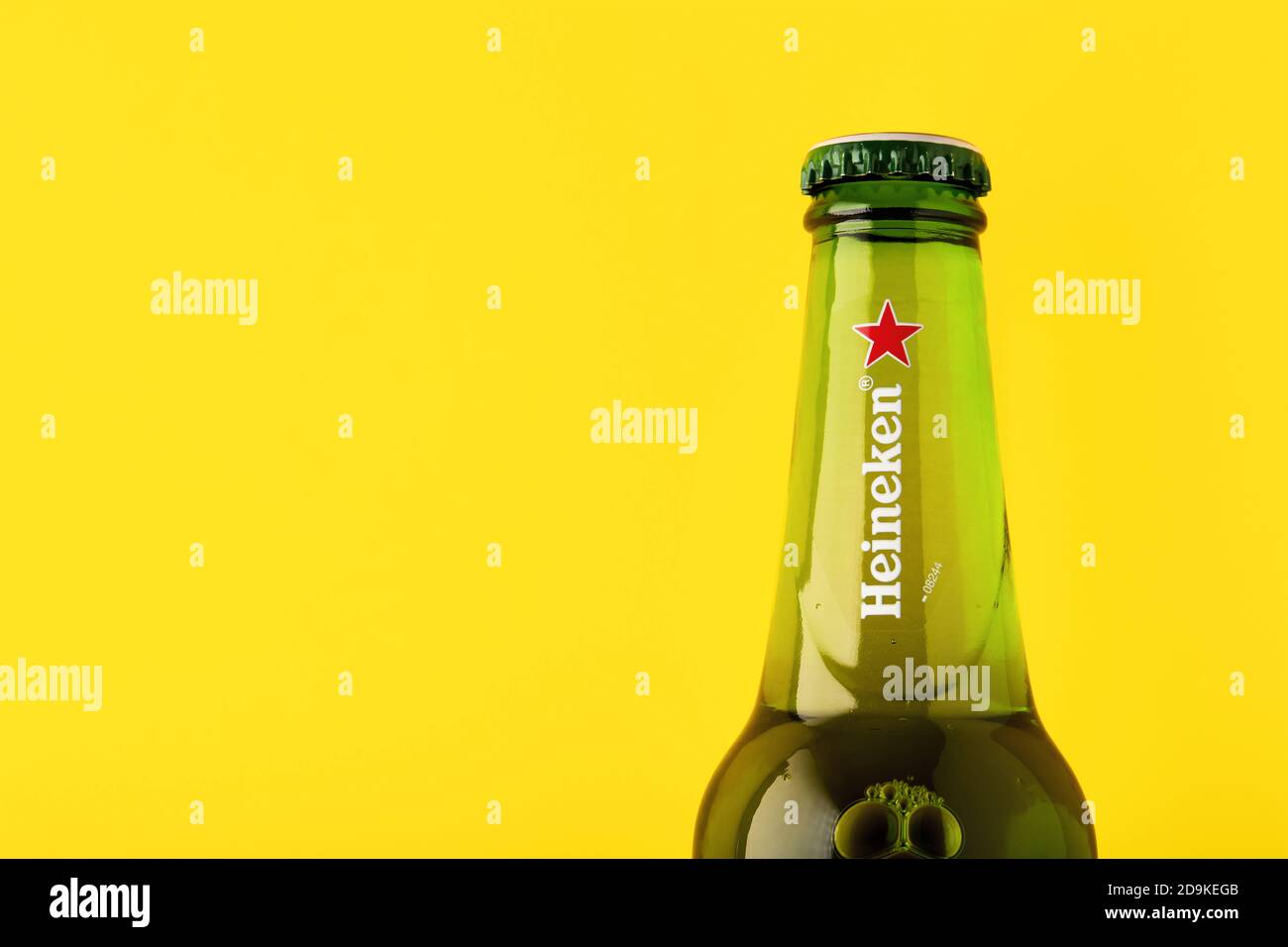 Bottle of Heineken Lager Beer on yellow background. Heineken is the ...