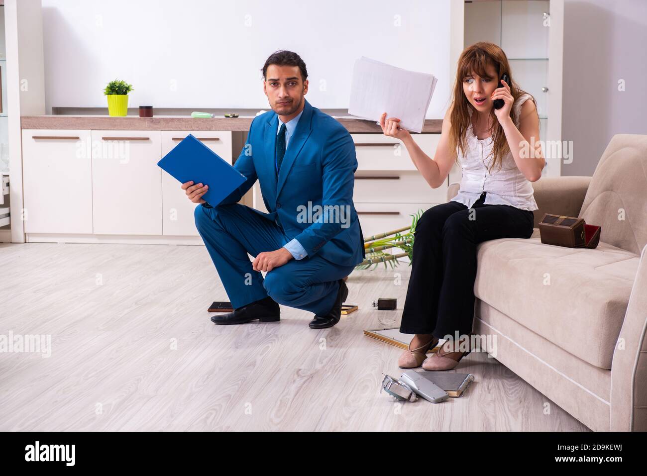 Female owner and police officer in housebreaking concept Stock Photo ...