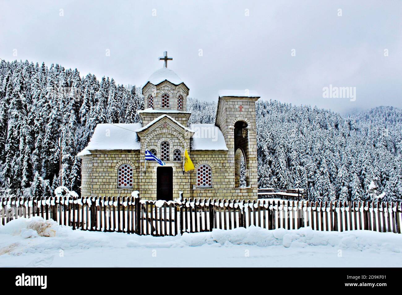 the most beautiful snow-covered church in the forest from a village in ...