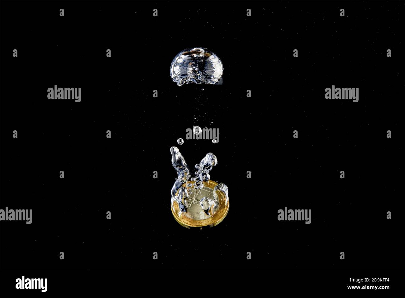 Sinking Euro. Splash of coins falling into the water. Coins in the ...