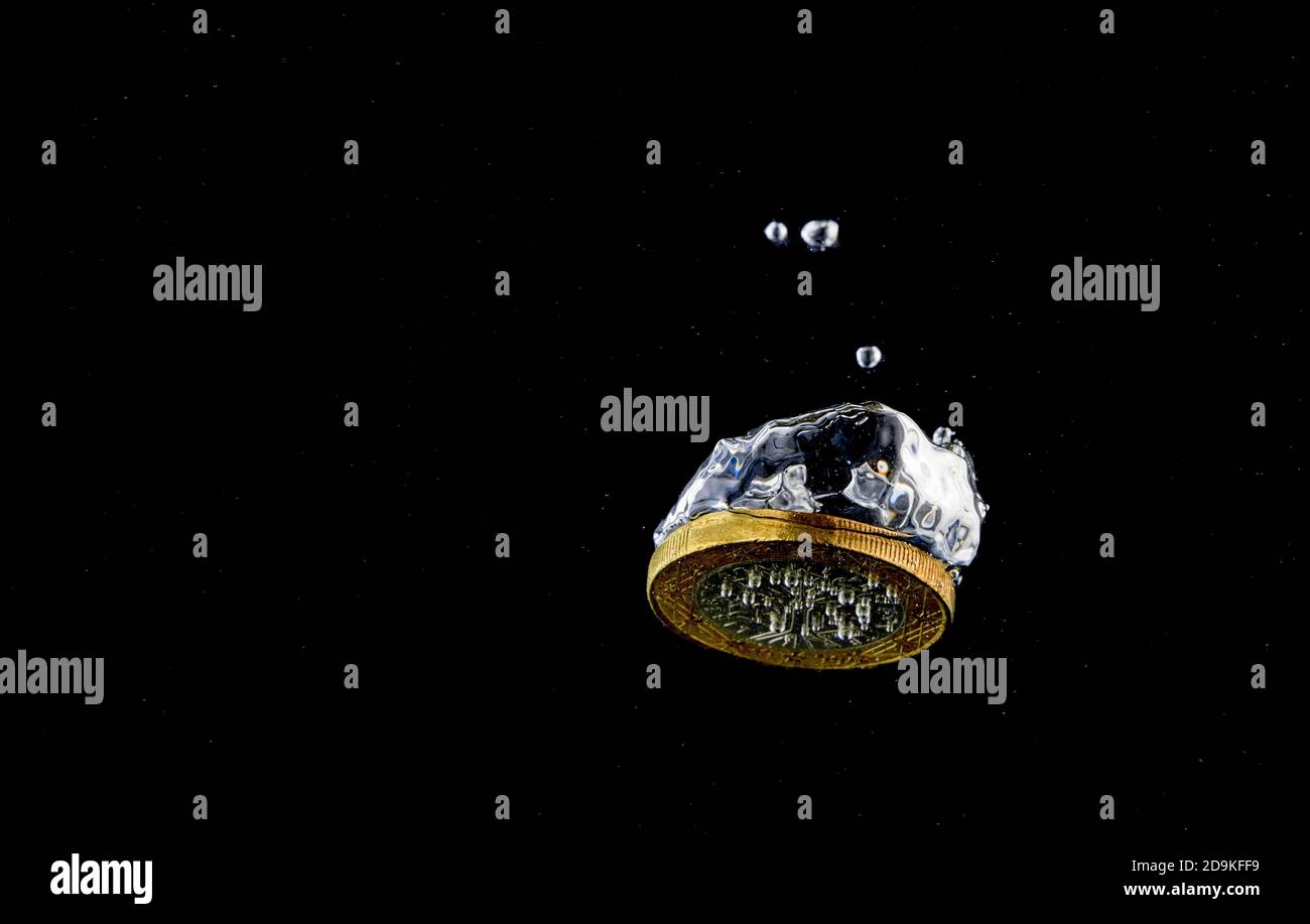 Sinking Euro. Splash of coins falling into the water. Coins in the ...