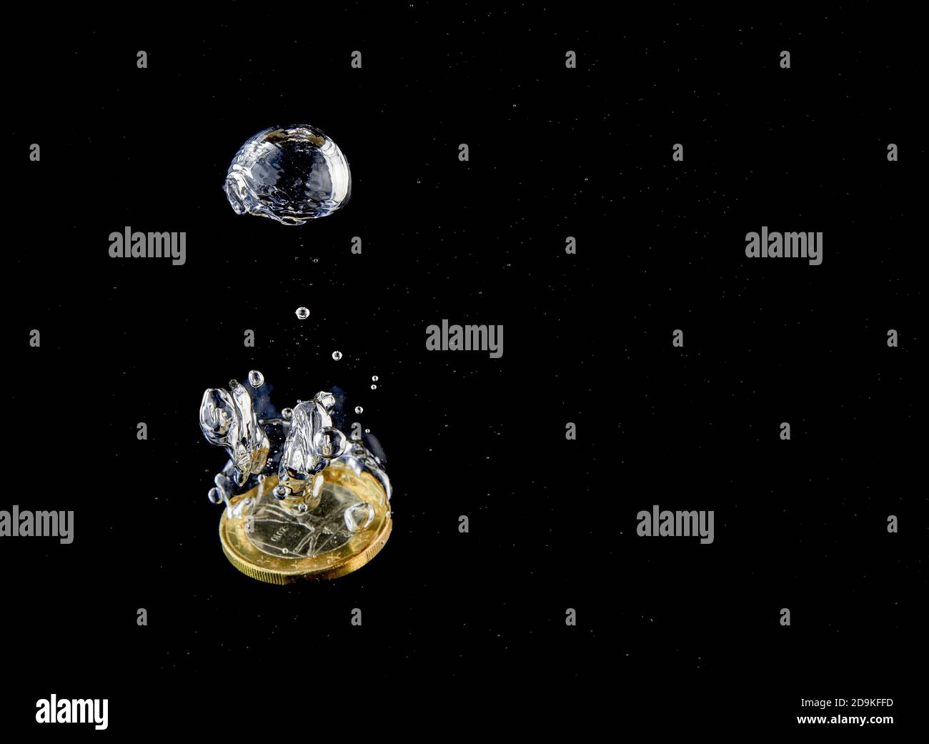 Sinking Euro. Splash of coins falling into the water. Coins in the ...
