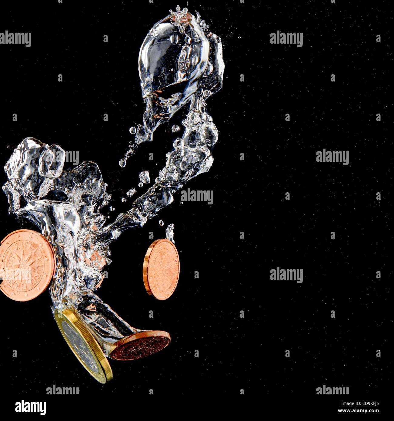 Sinking Euro. Splash of coins falling into the water. Coins in the ...