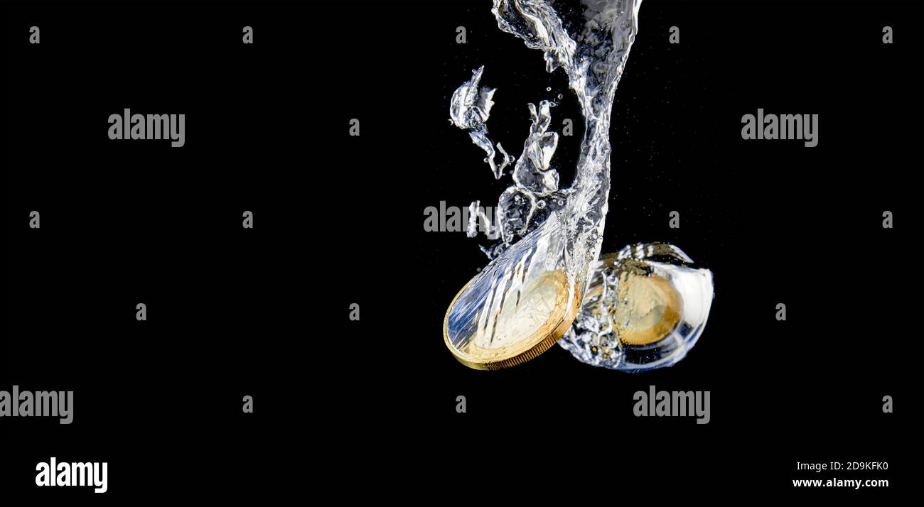 Sinking Euro. Splash of coins falling into the water. Coins in the ...