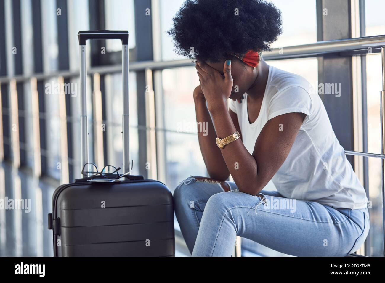 Sad and depressed young african american female passanger in casual ...