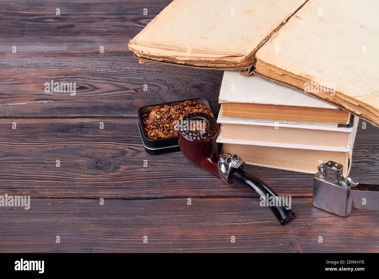 Top view books with smoking pipe and lighter Stock Photo - Alamy