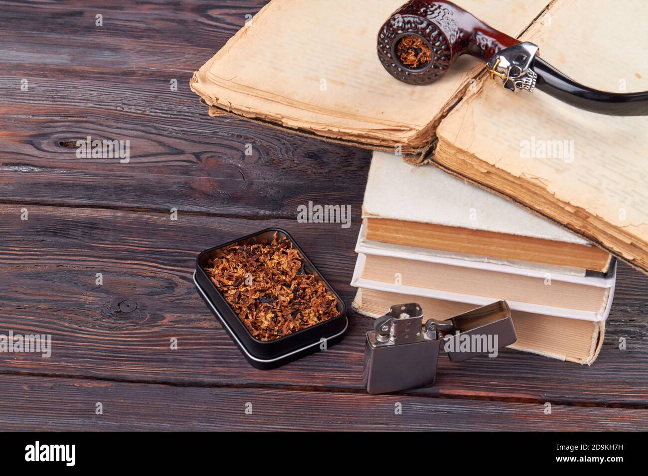 Books and pipe smoking accessoires Stock Photo - Alamy