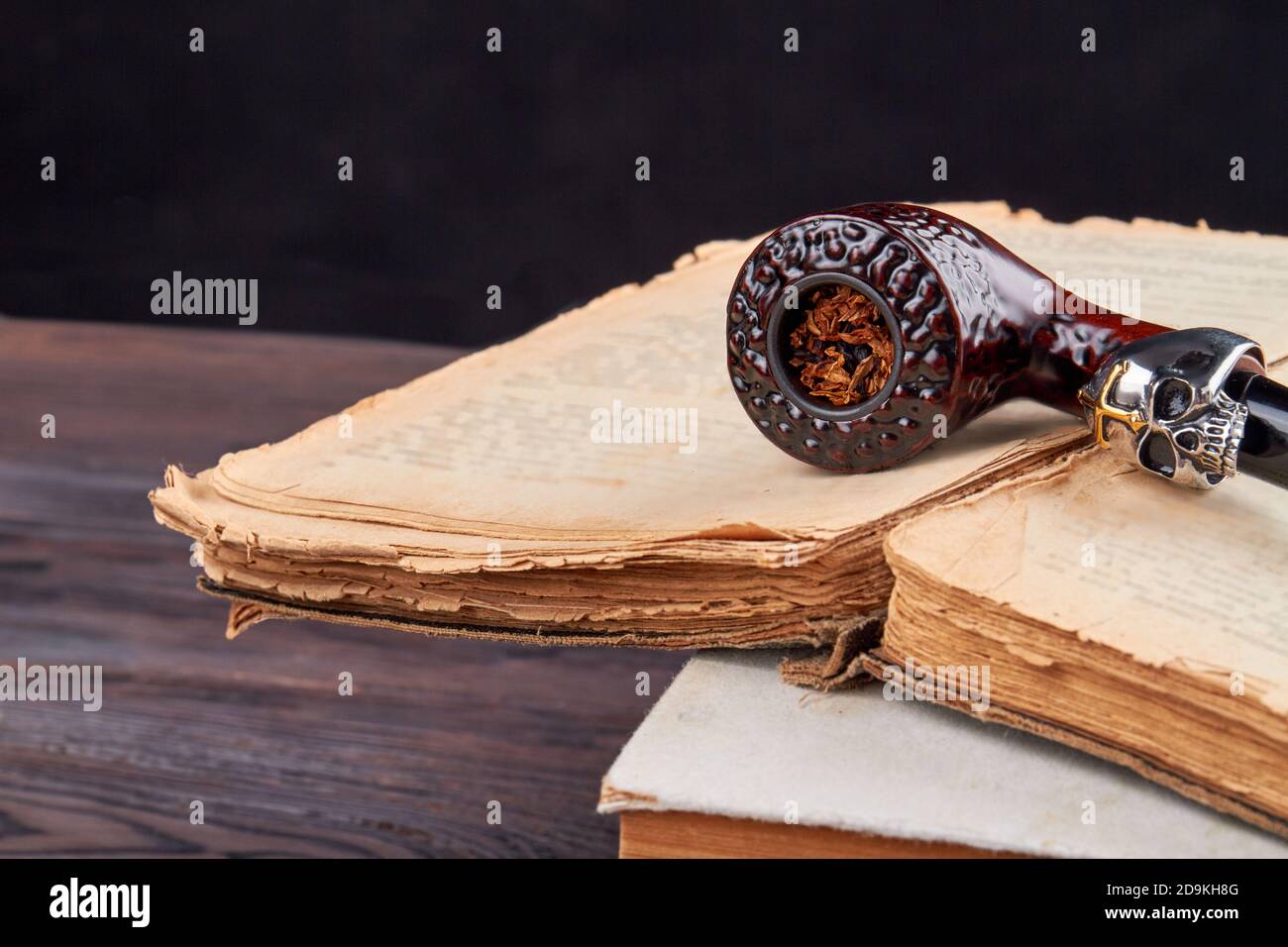 Close-up smoking pipe and old books Stock Photo - Alamy