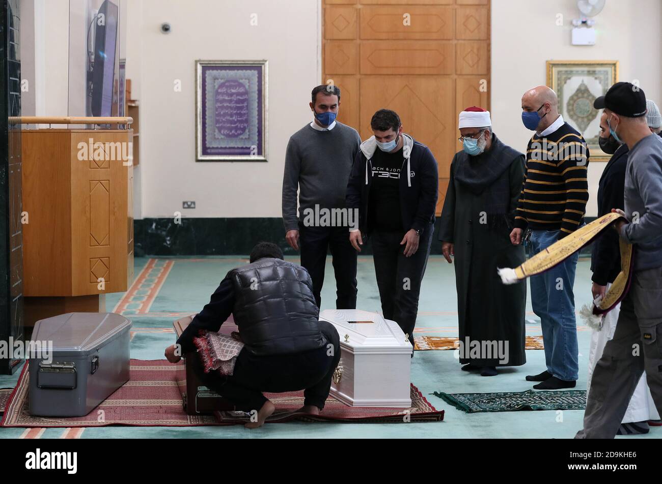 Imam Ahmed Halawa (centre) and mourners with the coffins of 37-year-old ...