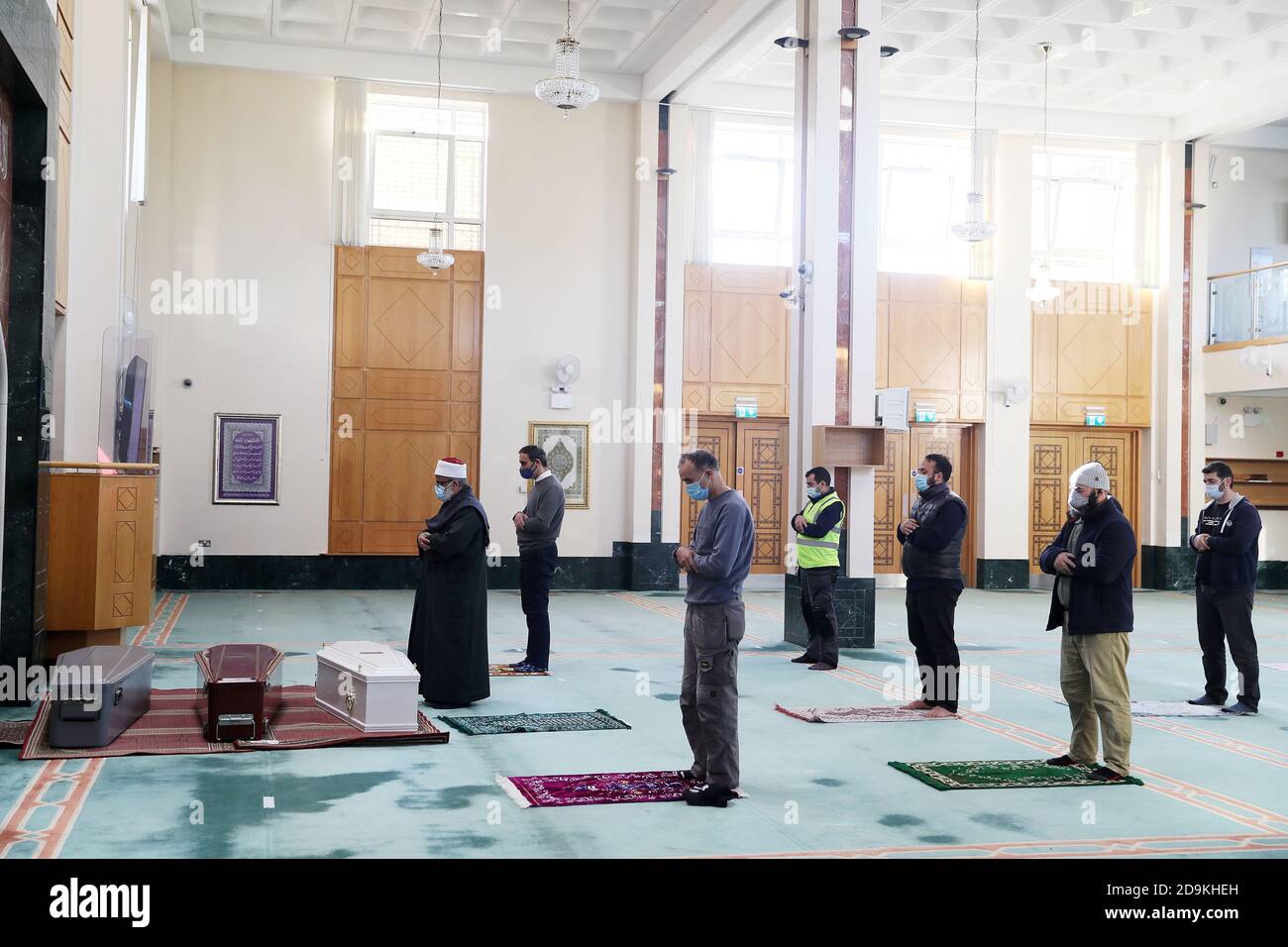 Imam Ahmed Halawa (left) and mourners with the coffins of 37-year-old ...