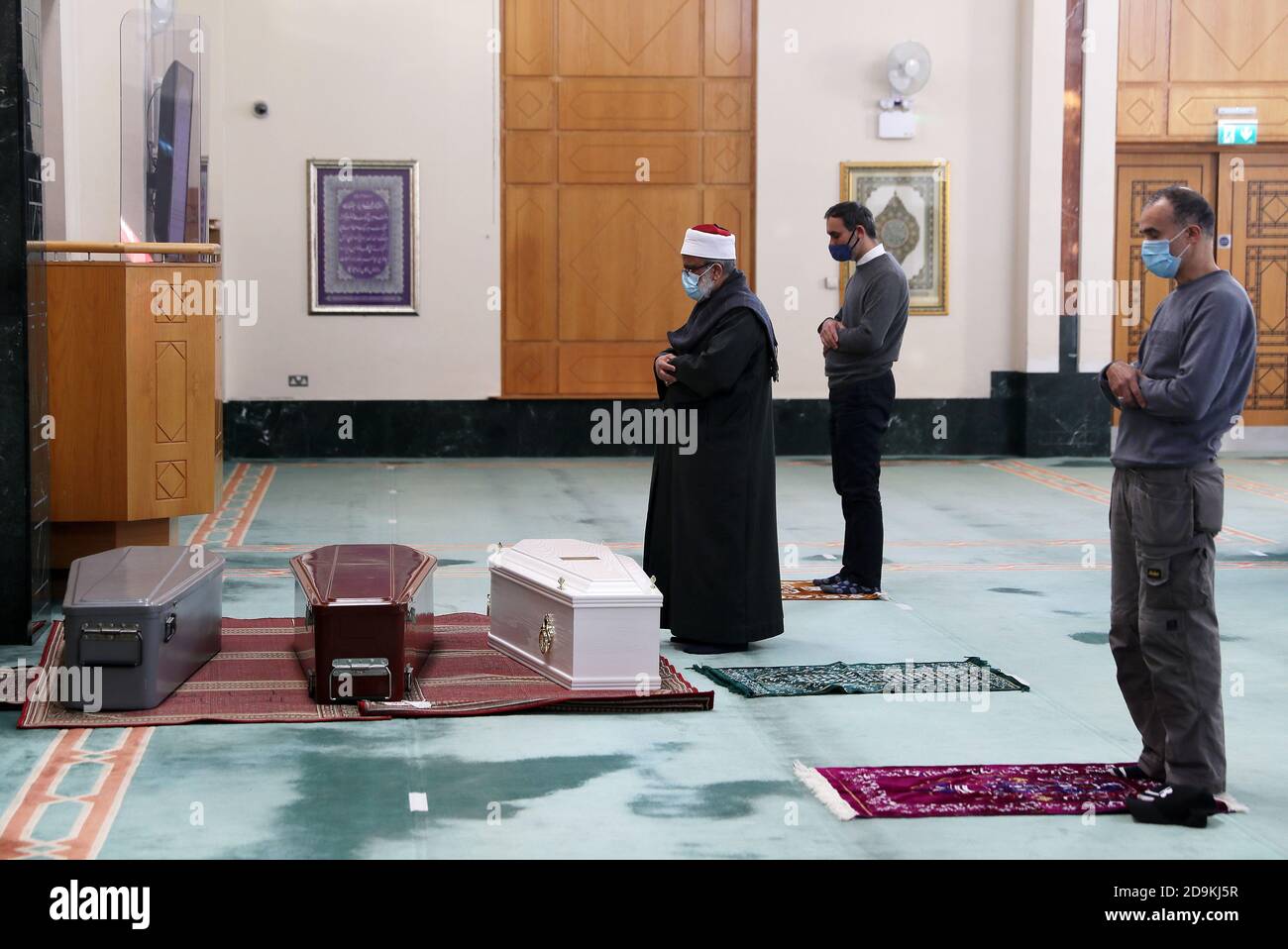 Imam Ahmed Halawa (left) and mourners with the coffins of 37-year-old ...