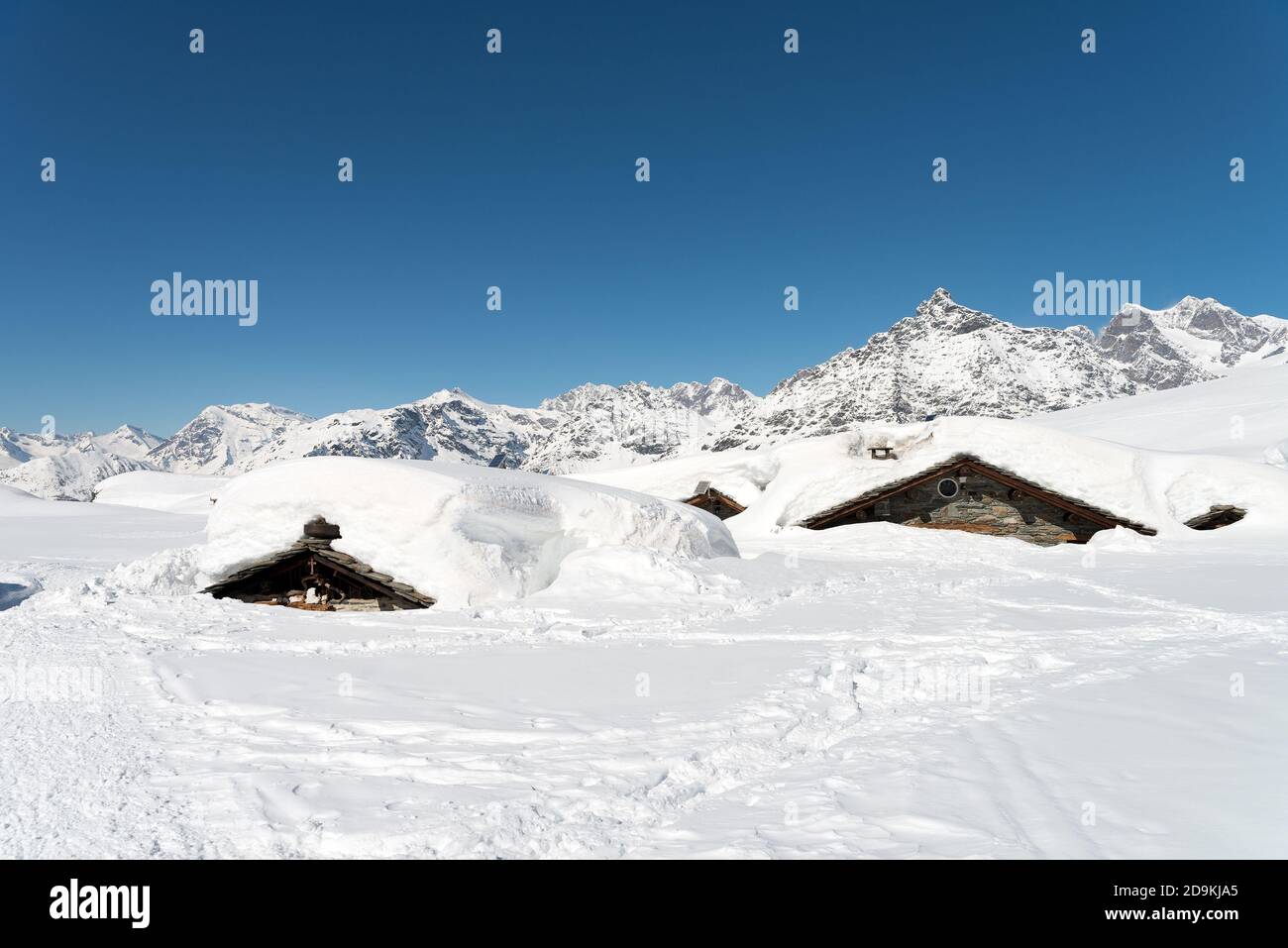 Valmalenco, Lombardy Alps, Italy: Mountain huts submerged by snow Stock ...