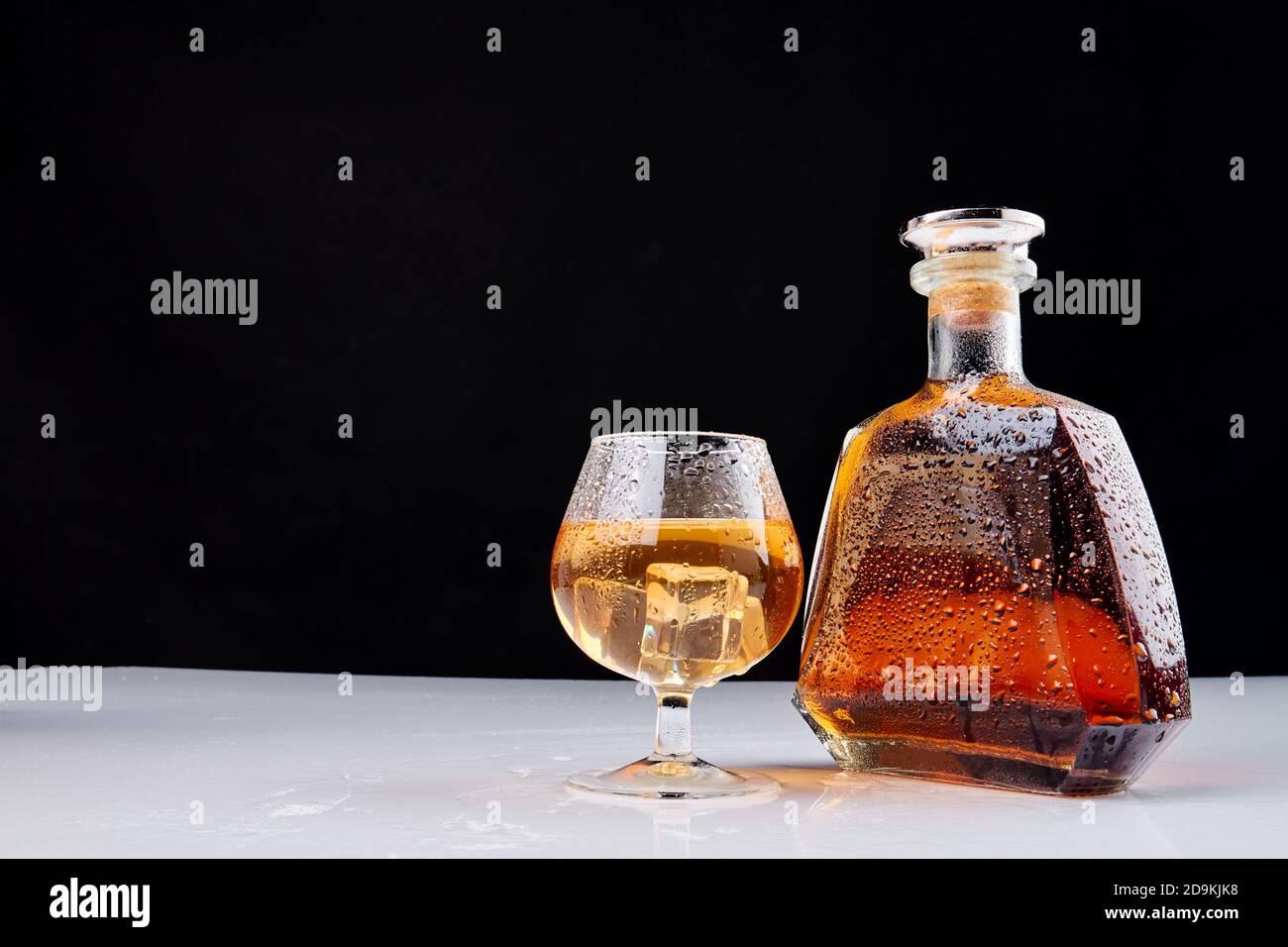 Glass of whiskey and bottle Stock Photo - Alamy