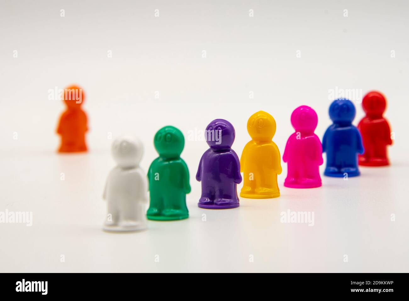 Small plastic men on a white background Stock Photo - Alamy