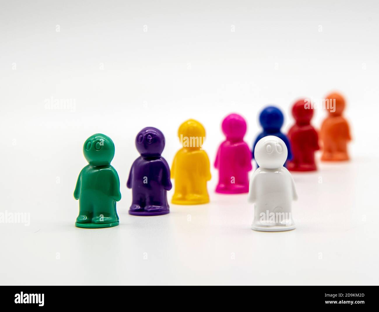 Small plastic men on a white background Stock Photo - Alamy