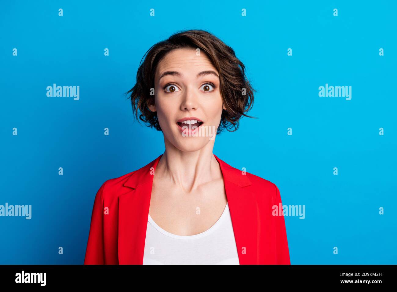 Close-up portrait of pretty amazed cheery brown-haired businesslady ...