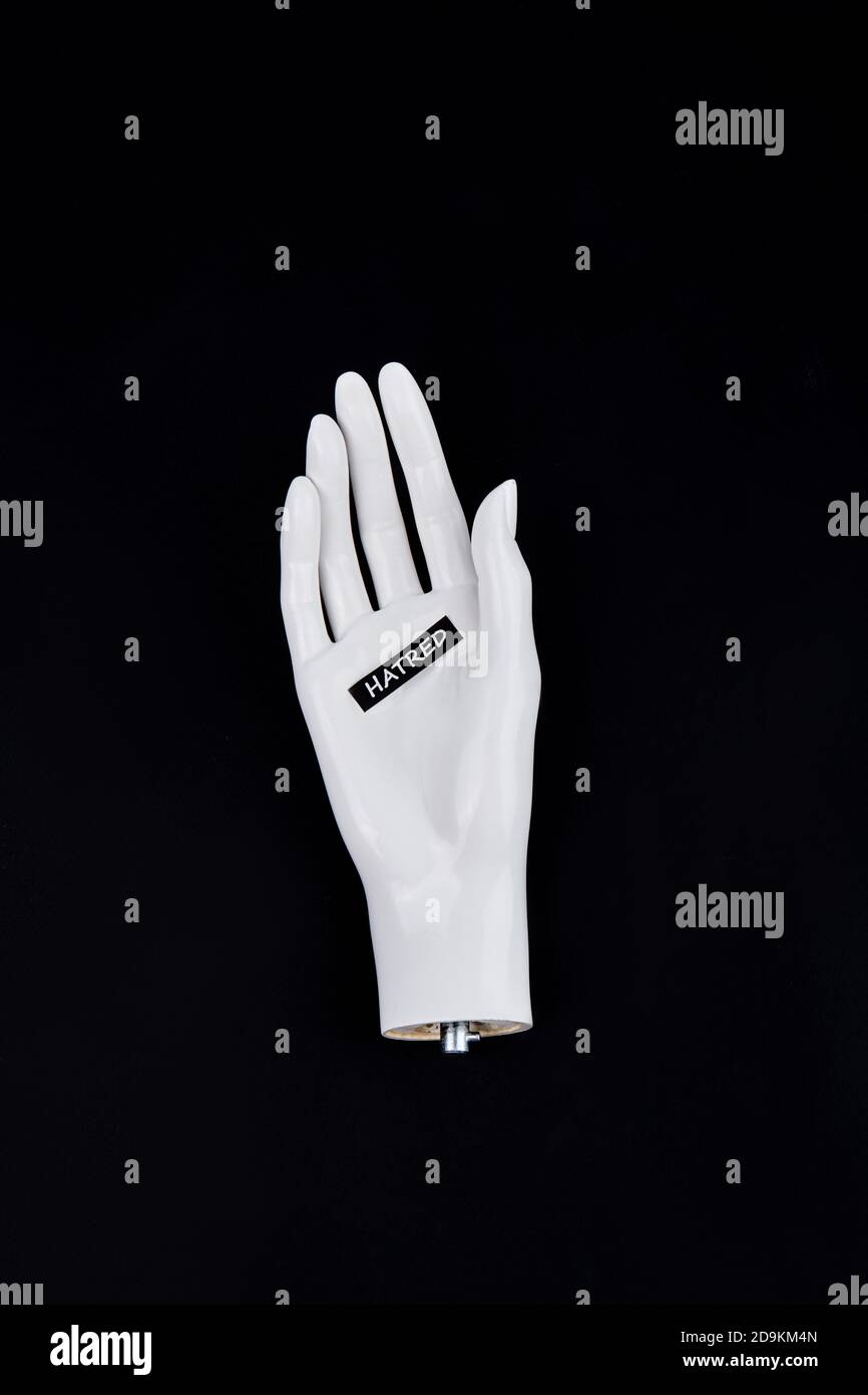 Vertical shot white hand and hatred word Stock Photo - Alamy
