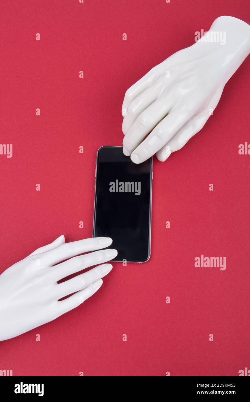 Mannequin hands touching smartphone Stock Photo - Alamy