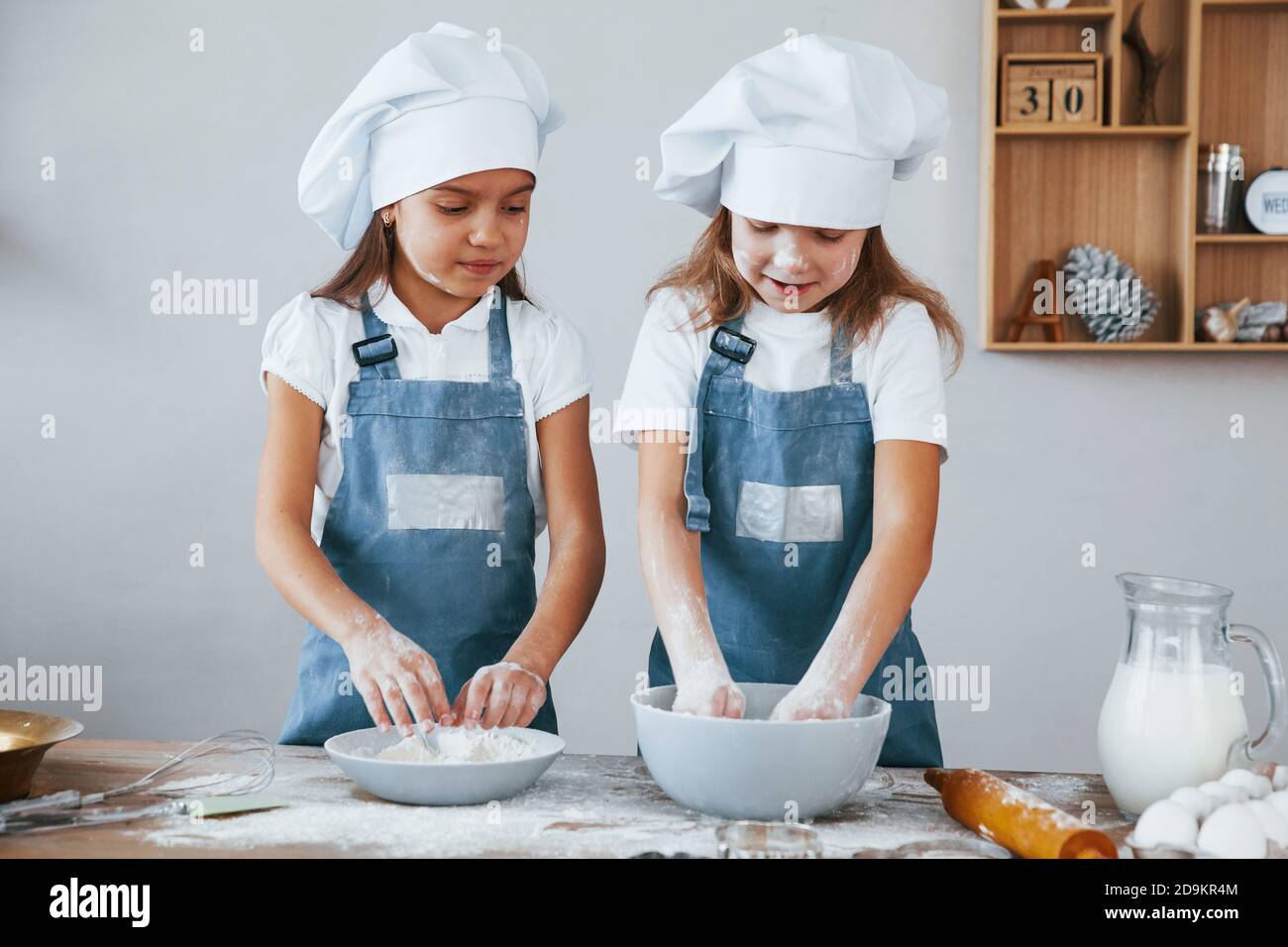 Two sisters cooking together hi-res stock photography and images - Alamy