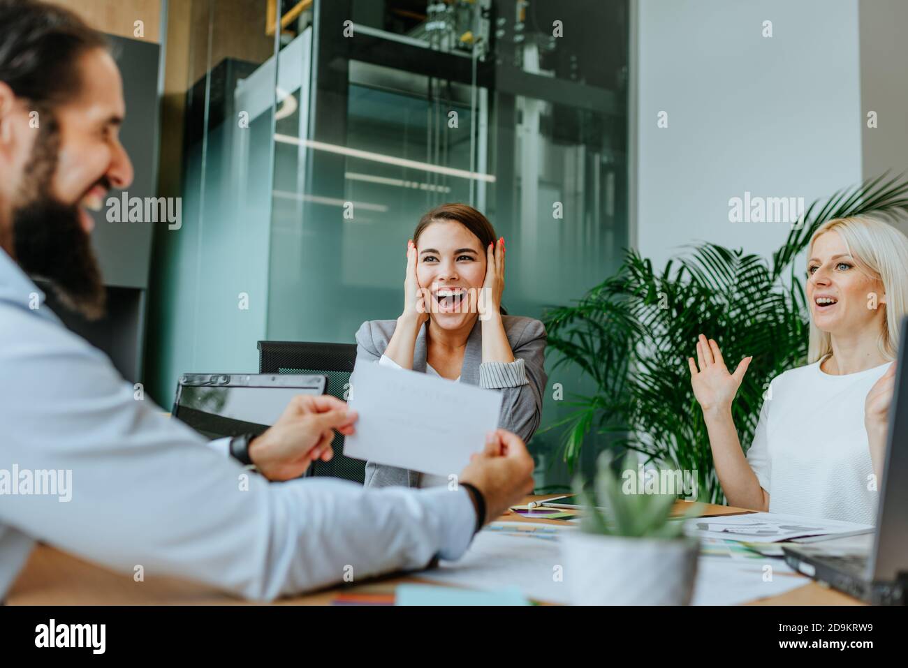 Happy smiling business woman receiving a certificate sitting at the ...
