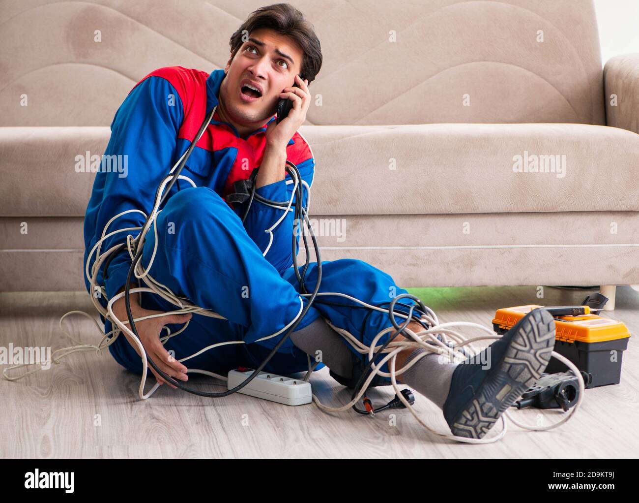 The electrician contractor with tangled cables Stock Photo - Alamy