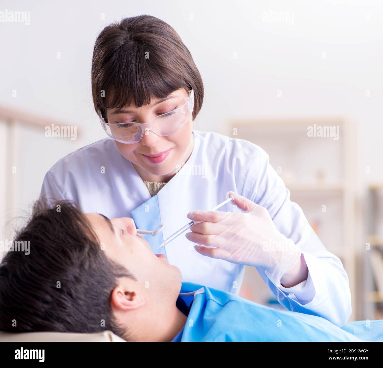 The patient visiting dentist for regular check-up and filling Stock ...