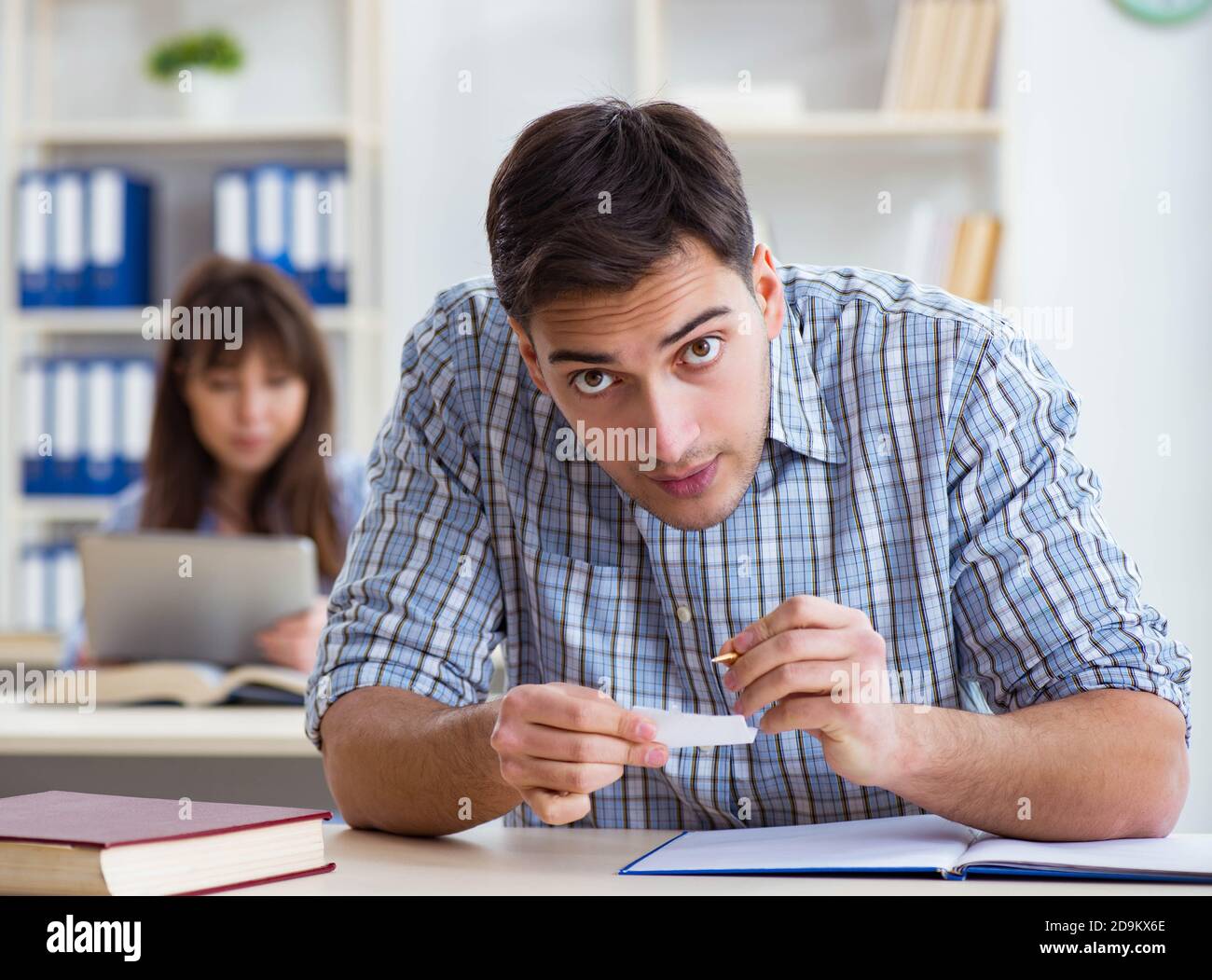 The students sitting and studying in classroom college Stock Photo - Alamy