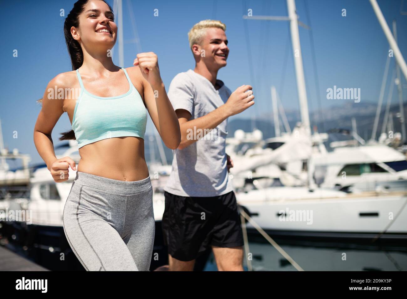 Running happy people hi-res stock photography and images - Alamy