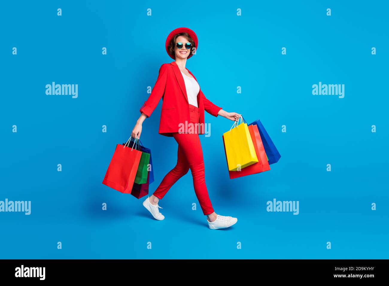 Full length body size profile side view of pretty cheerful lady wearing ...