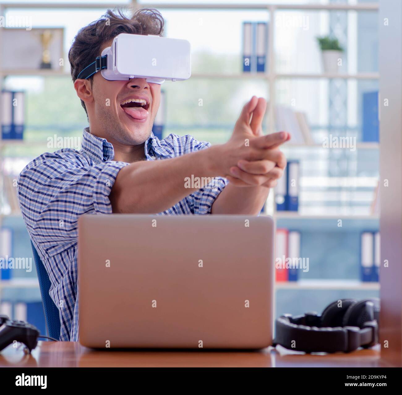The young man playing computer game with virtual reality glasses Stock ...