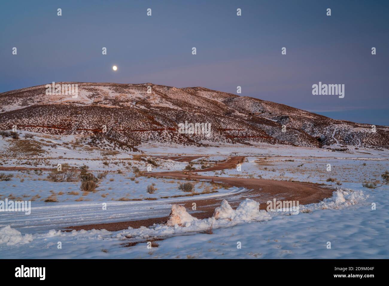 windy ranch road in Colorado mountain valley, fall evening after sunset ...