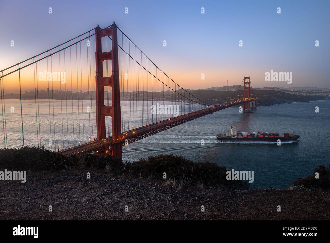Golden Gate Bridge and cargo ship in the beautiful morning Stock Photo ...
