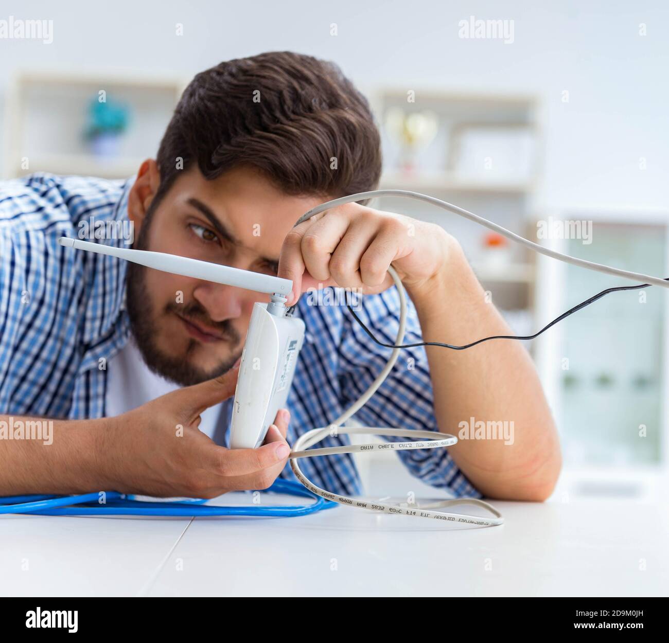 The frustrated young man due to weak internet reception Stock Photo - Alamy