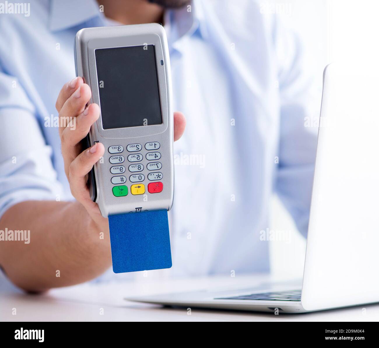 The man processing credit card transaction with pos terminal Stock ...