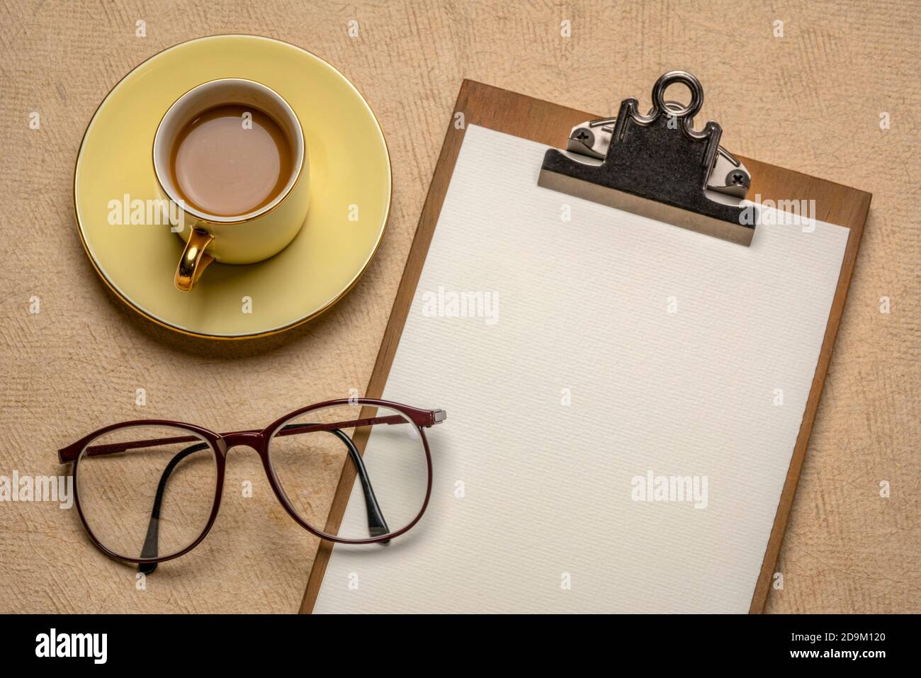business desktop concept - clipboard with blank paper,reading glasses ...