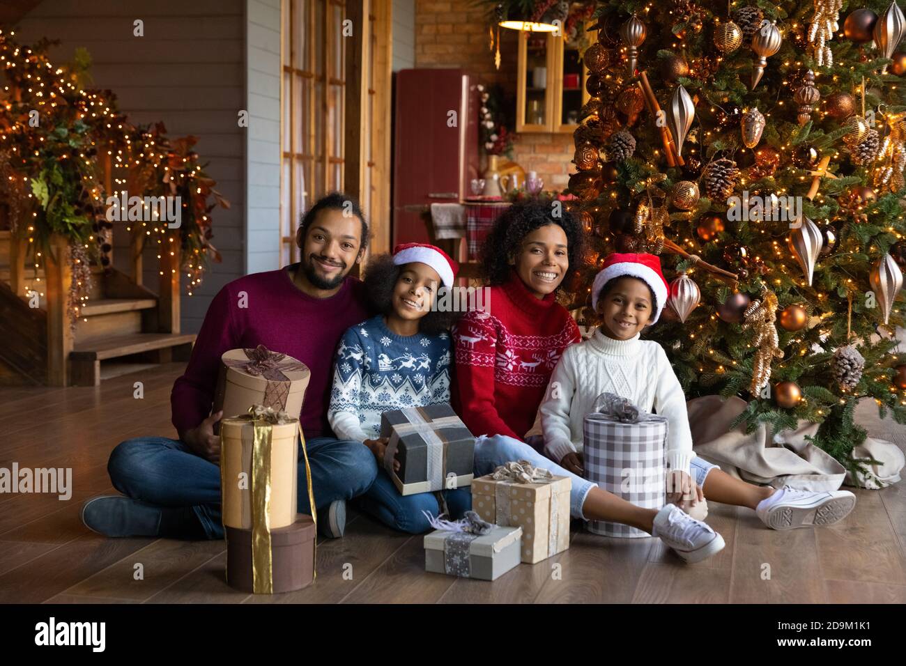 Portrait happy African American family wearing festive caps celebrating ...