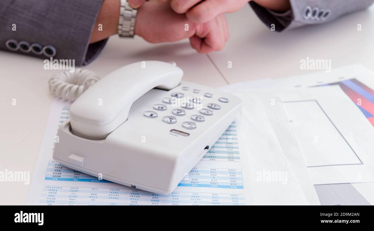 The businessman expecting important call on phone Stock Photo - Alamy