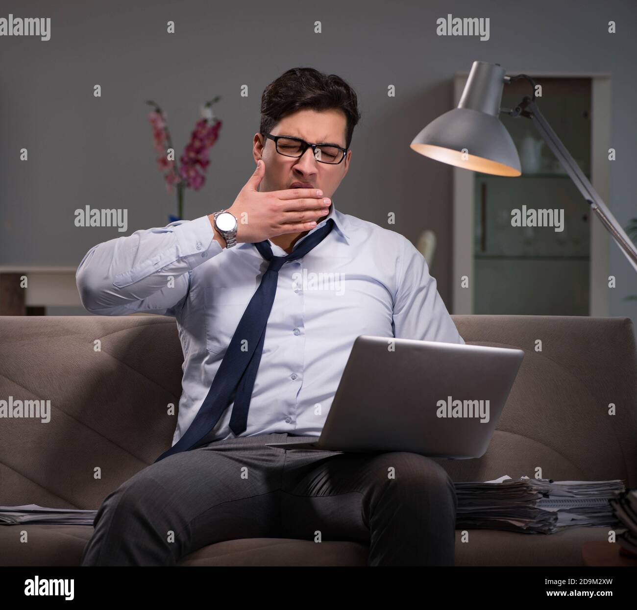 The businessman workaholic working late at home Stock Photo - Alamy